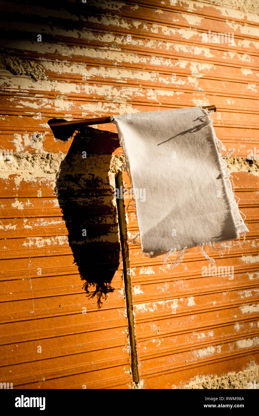 Ragged cloth being waved as a white flag Stock Photo - Alamy