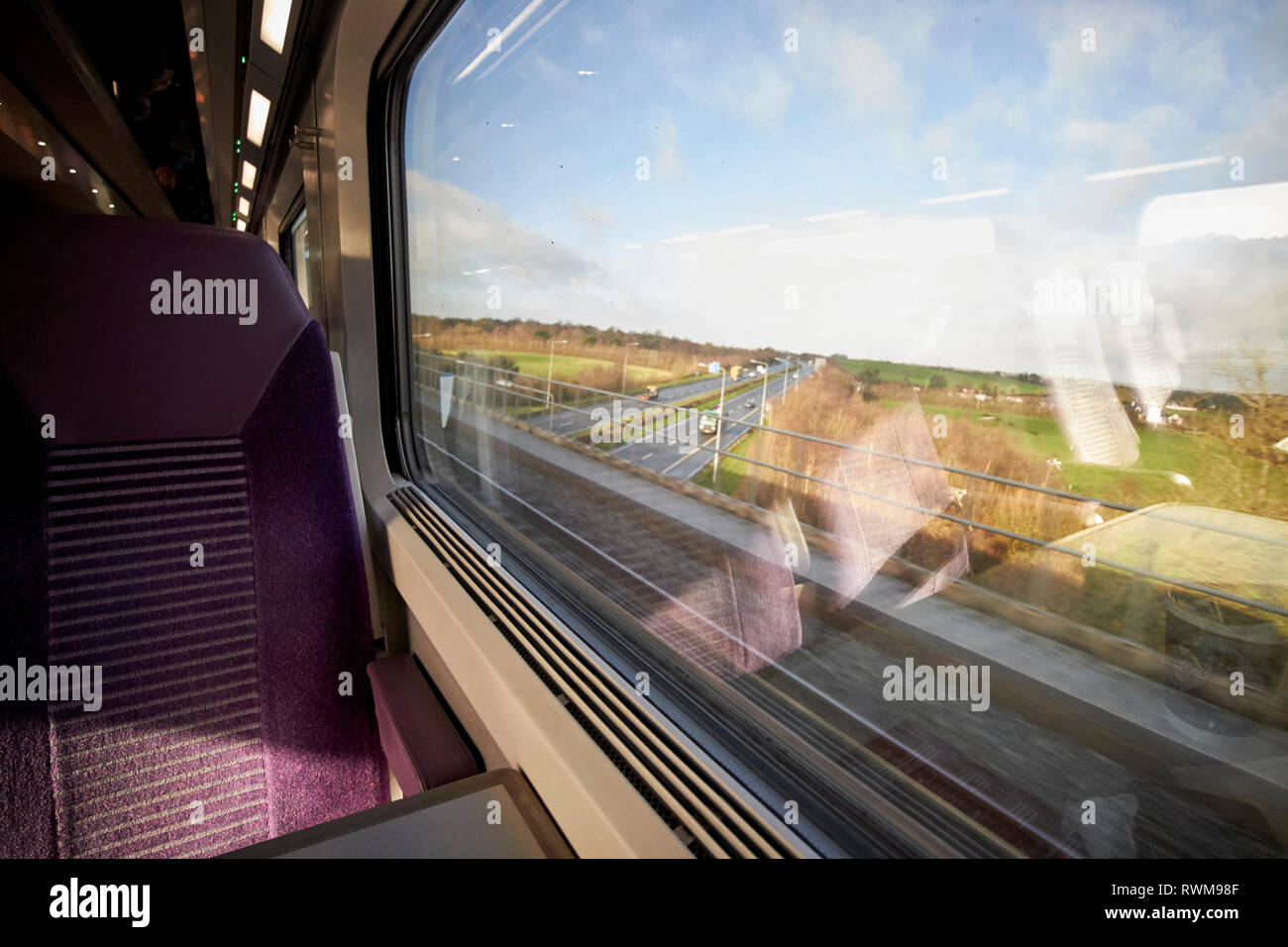 enterprise train between Belfast and Dublin crossing the M1 A1 motorway ...