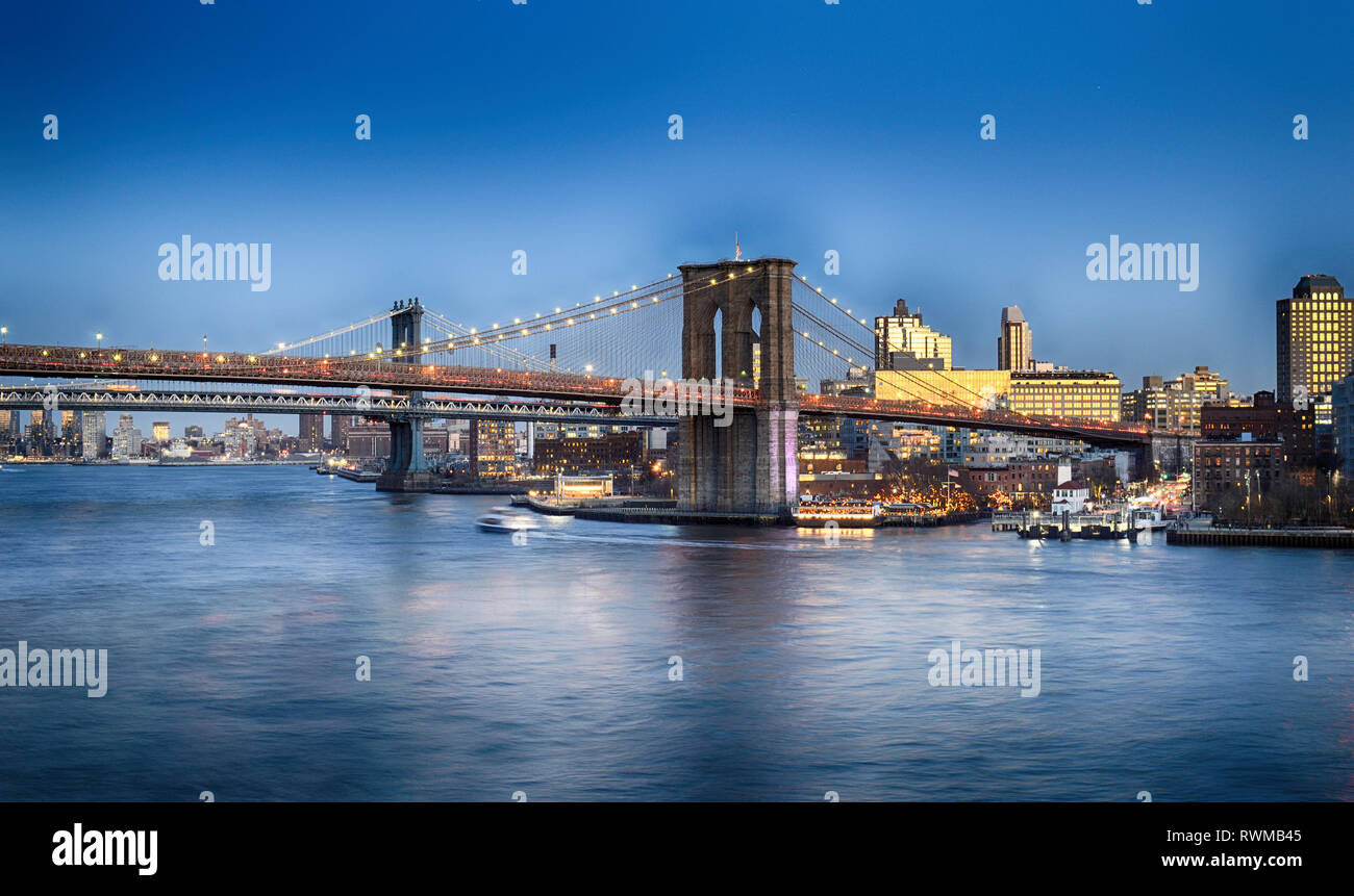 HDR view of two bridges of New York City at night Stock Photo - Alamy