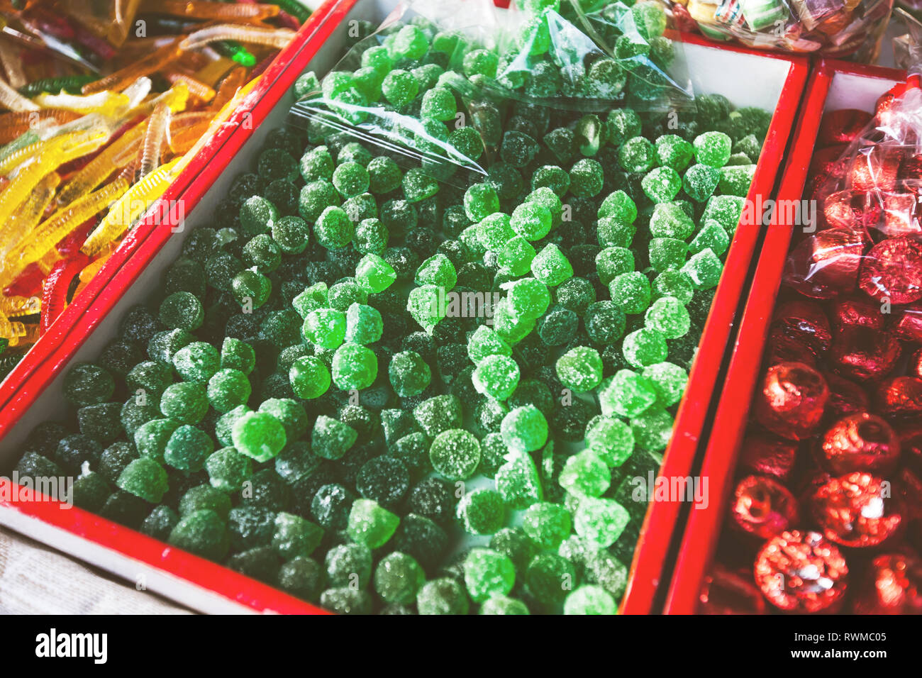 colorful sweets gummy candies at candy shop on festive markets Stock ...