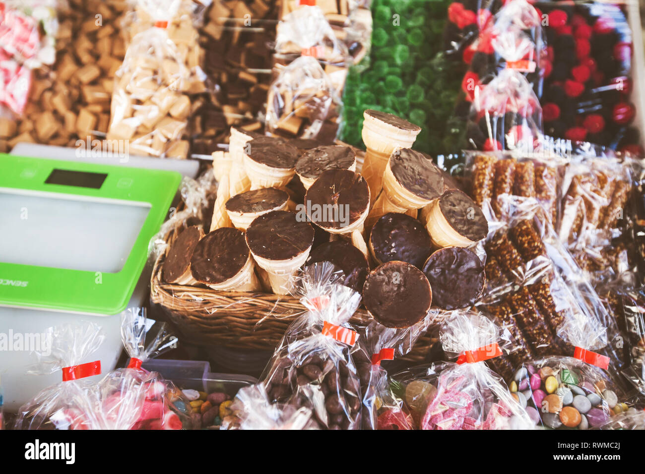 various sweets at candy store on open festive shops Stock Photo - Alamy