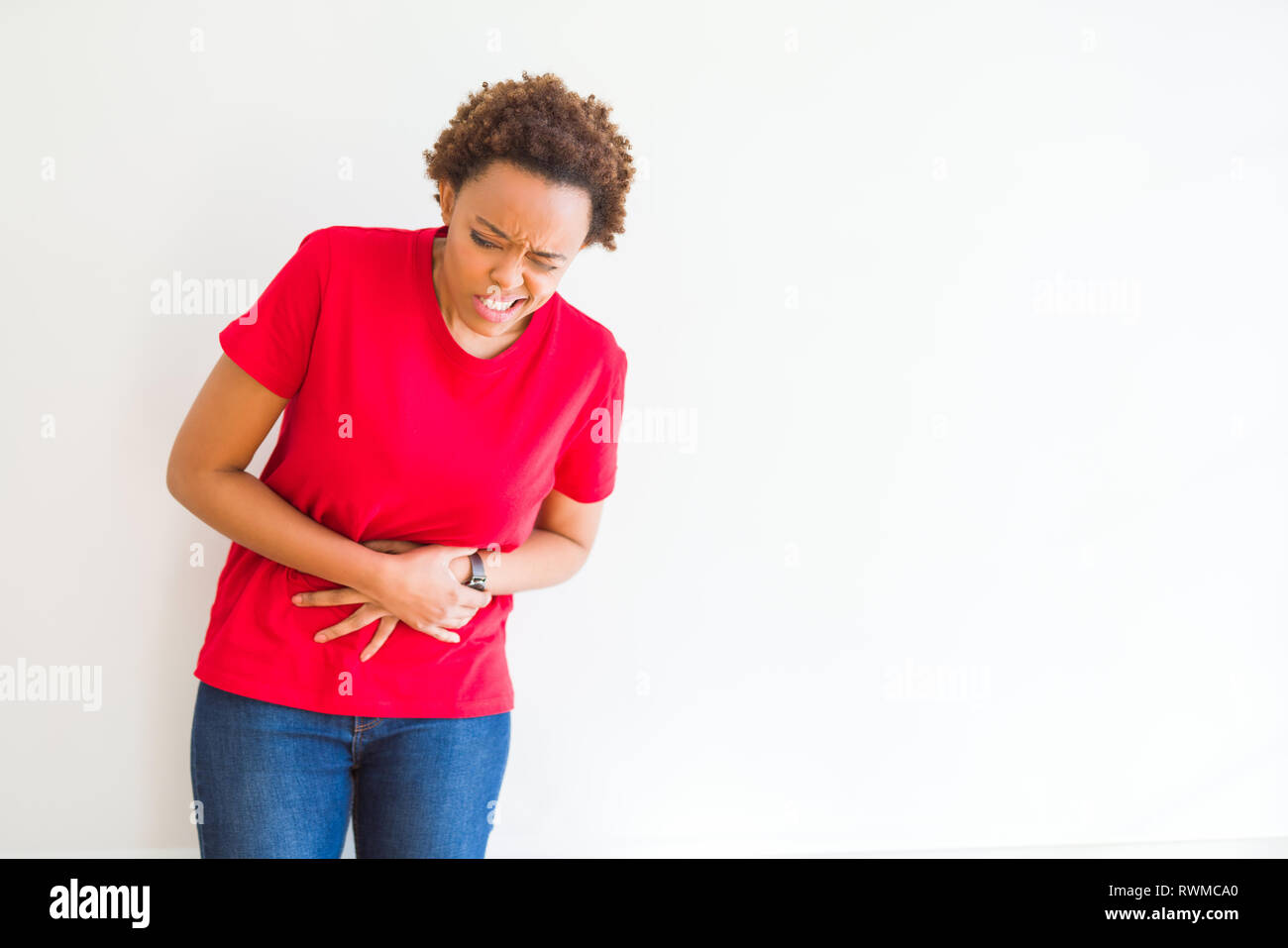 Young beautiful african american woman over white background with hand ...
