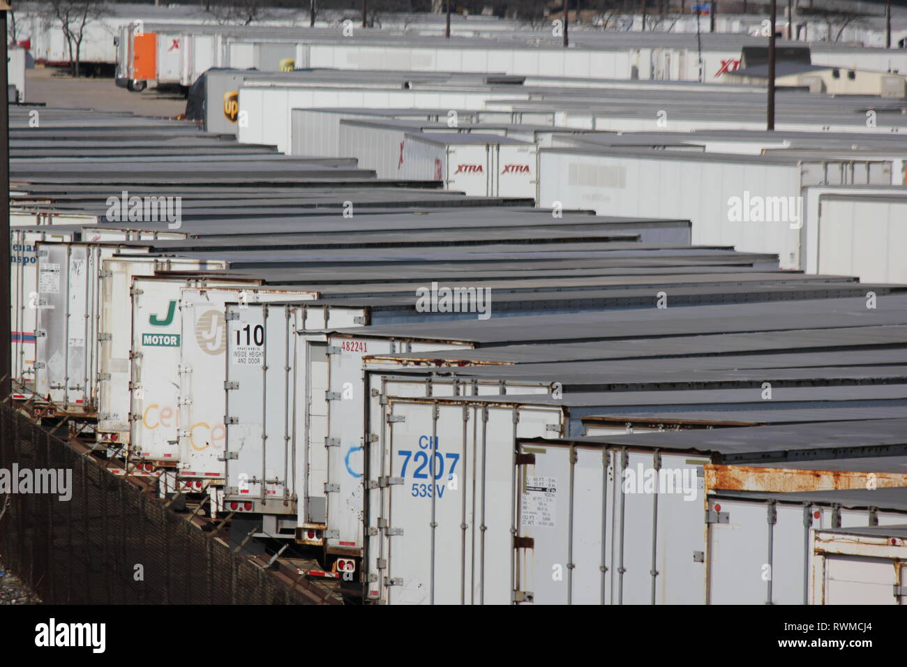 Truck parking lot loaded with parked trucks Stock Photo - Alamy