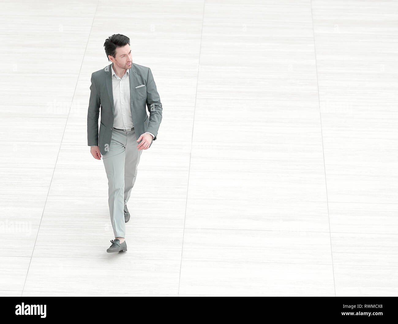 Young white male walking confidently hi-res stock photography and ...