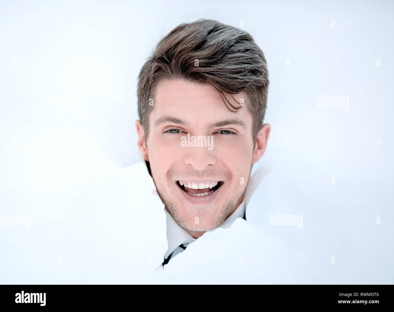 smiling businessman breaks through the paper Stock Photo - Alamy