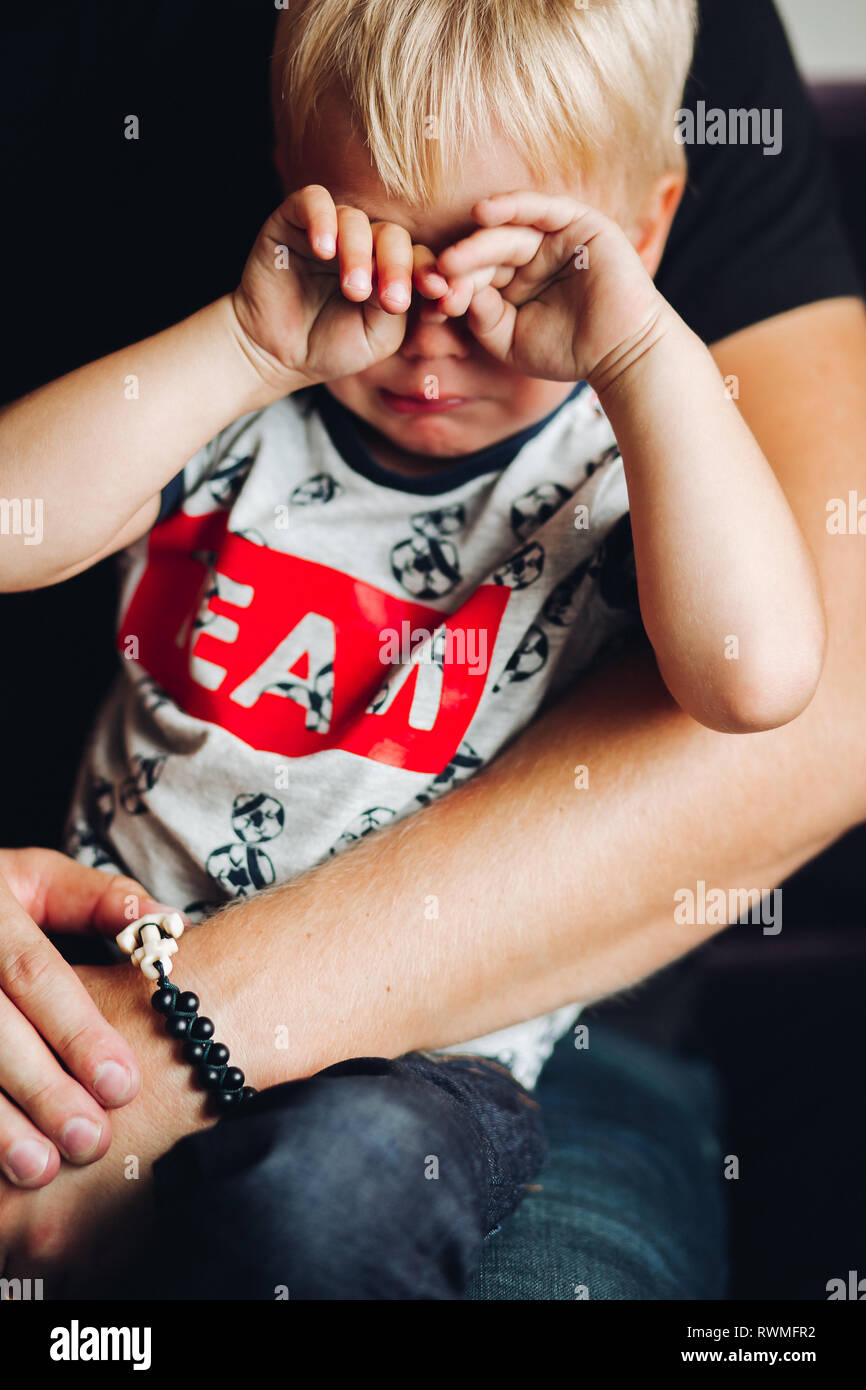 The baby is crying. The little boy is crying heavily Stock Photo - Alamy
