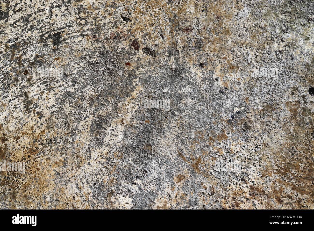 Close up detailed surface of granite and concrete mixed walls in high ...