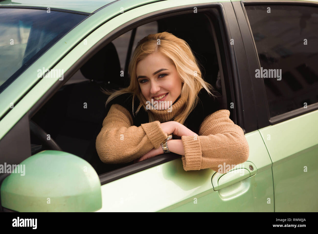Young woman driving her car, lady drive the car casually Stock Photo ...