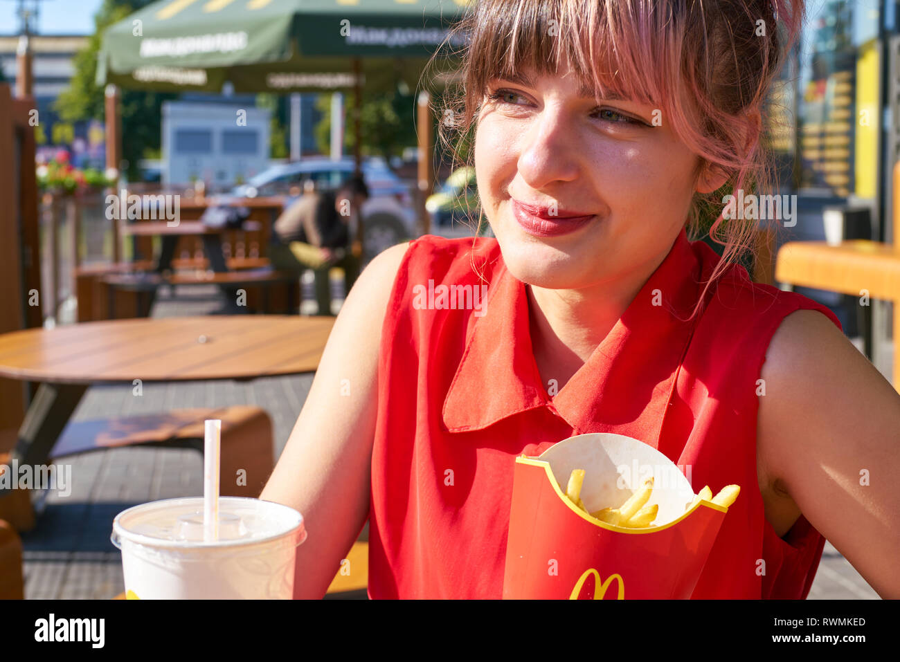 KALININGRAD, RUSSIA - CIRCA SEPTEMBER, 2018: young woman at McDonald's ...