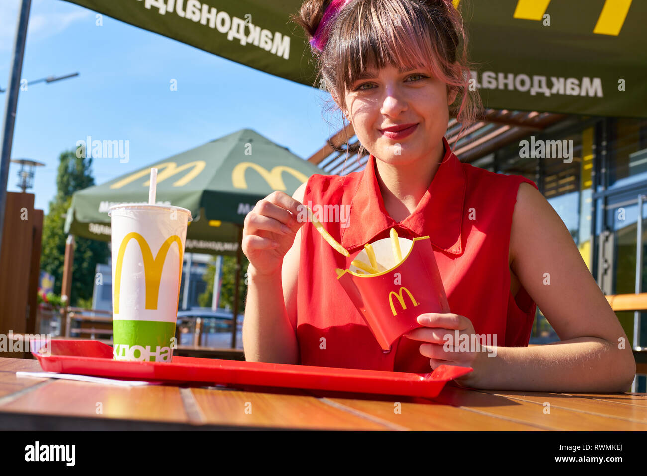 KALININGRAD, RUSSIA - CIRCA SEPTEMBER, 2018: young woman at McDonald's ...