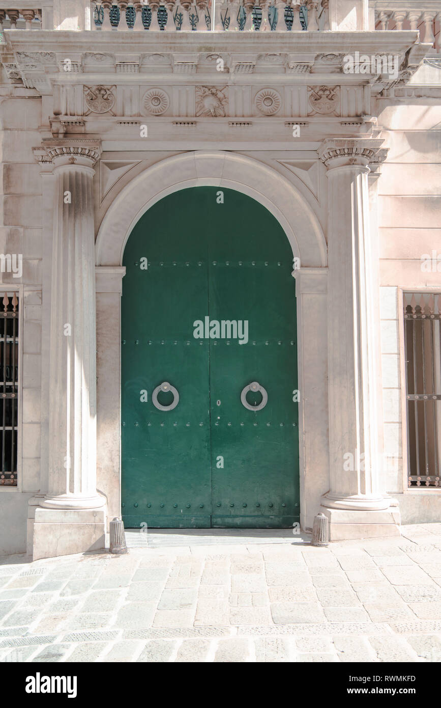 Metal gate green colored from an ancient italian building in the ...
