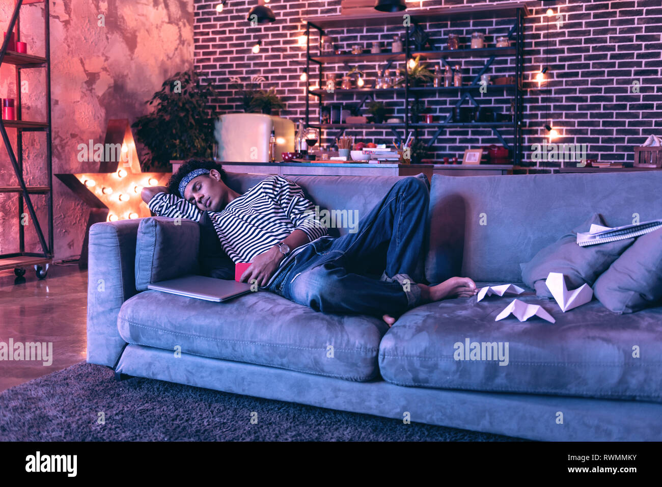 Man sleeping in waiting room hi-res stock photography and images - Alamy