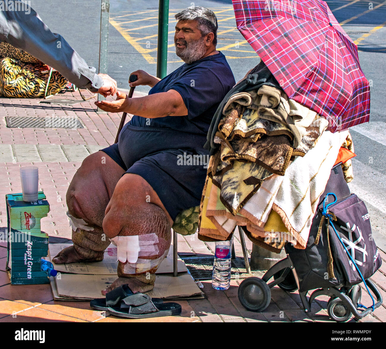 Murcia / Spain - March 4 - 2019: Poor unhealthy man begging for alms in ...
