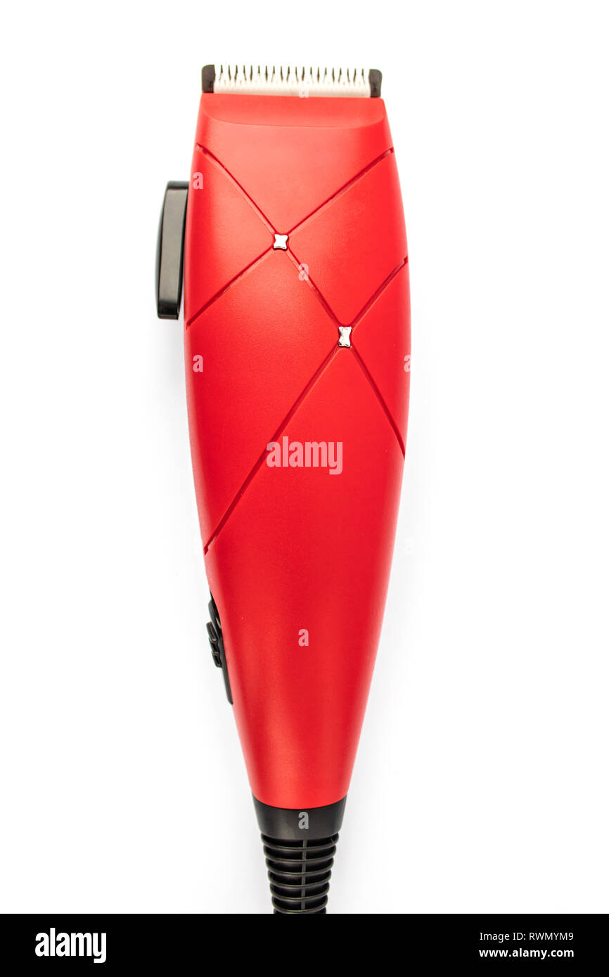 Red hair clipper on a white background close-up Stock Photo - Alamy