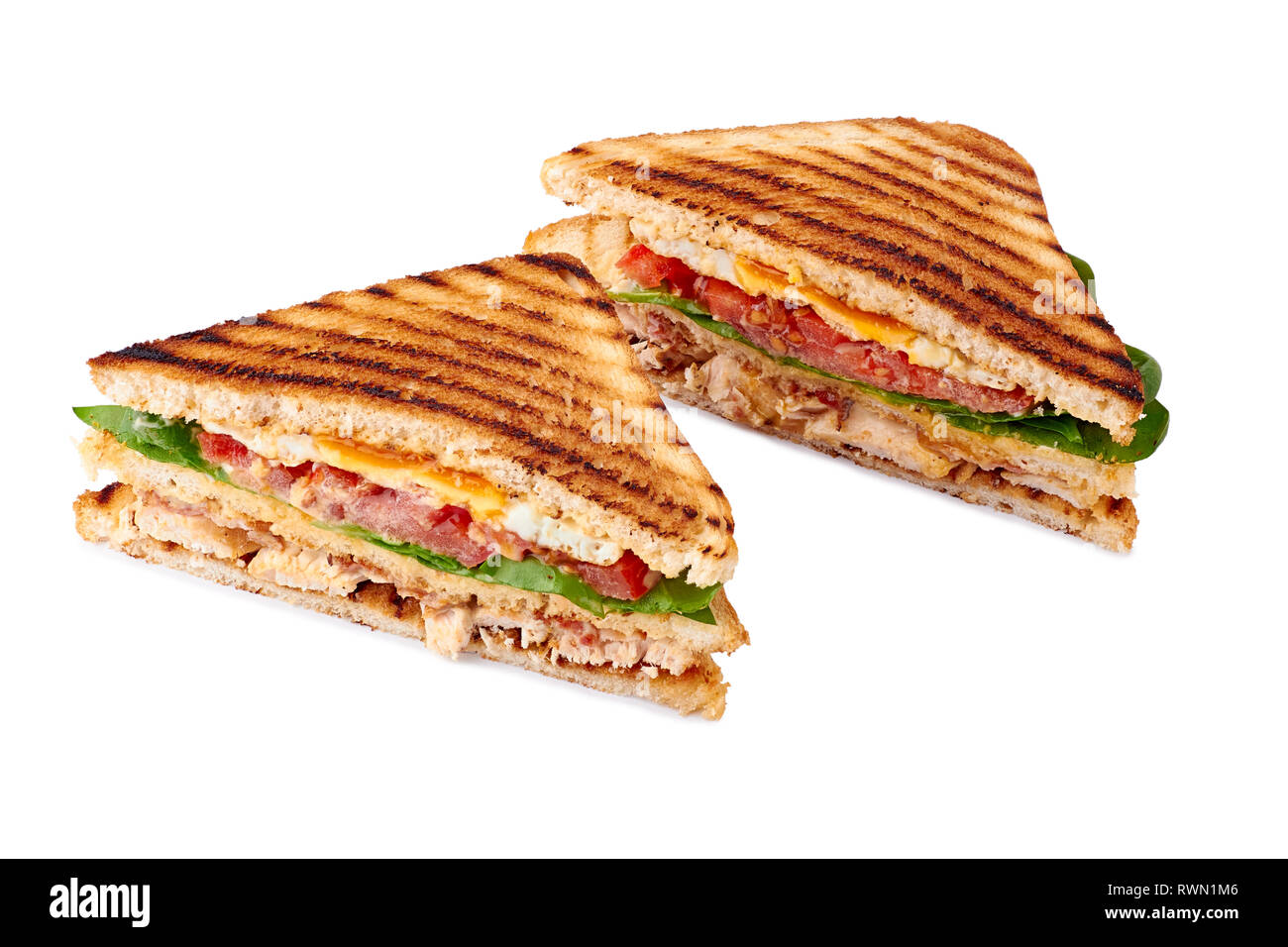 Juicy sliced club sandwich on white background Stock Photo - Alamy