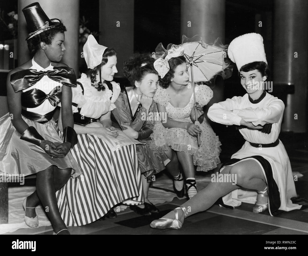 Audrey Hepburn, with the cast of theater production for children, (1949 ...