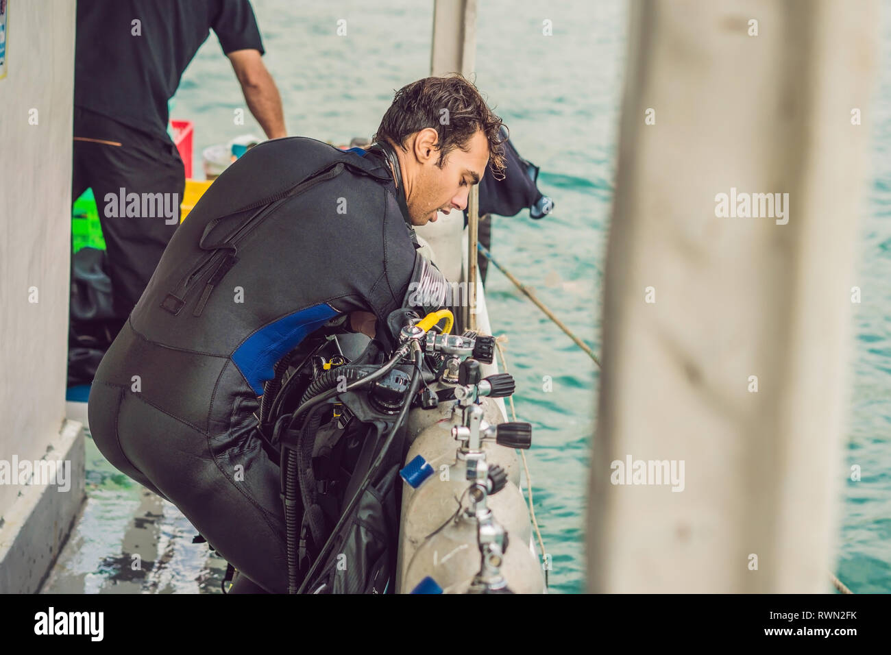 Diver preparing to dive into the sea Stock Photo - Alamy