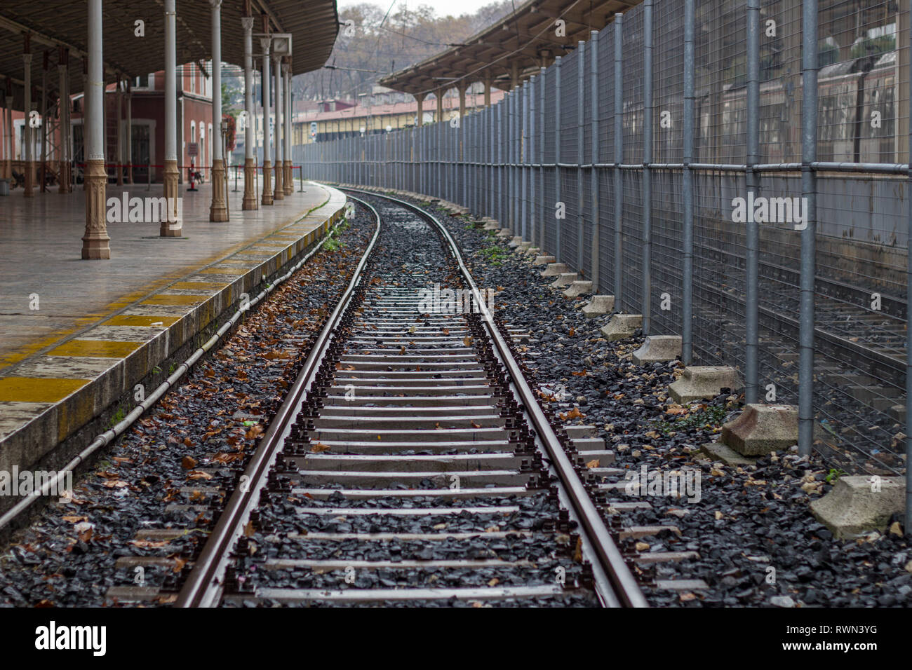 Train station railway in the city Stock Photo - Alamy