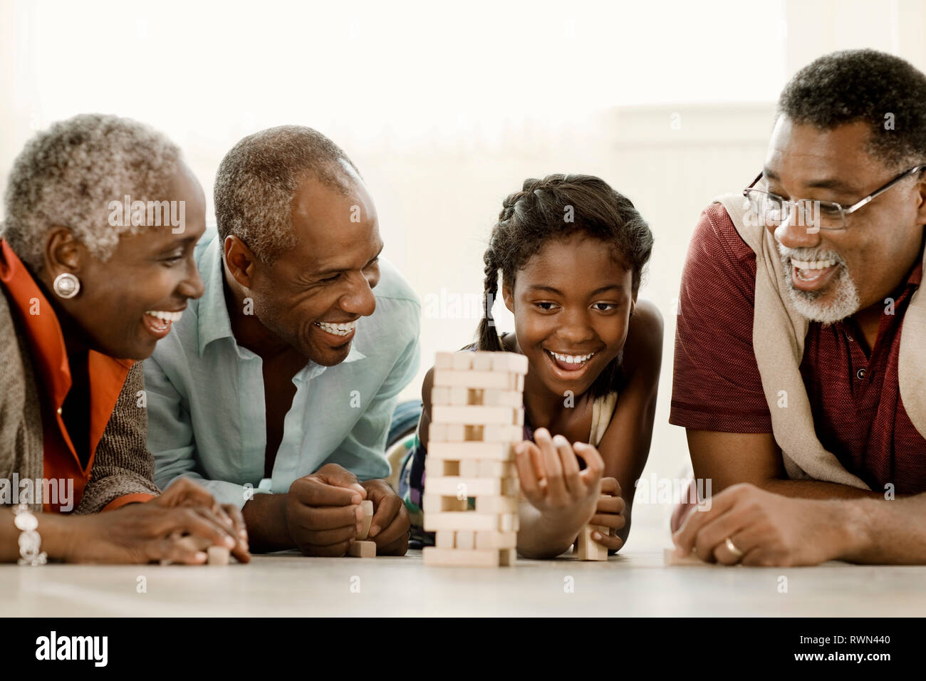 Smiling multi generational family playing a block removal game Stock ...