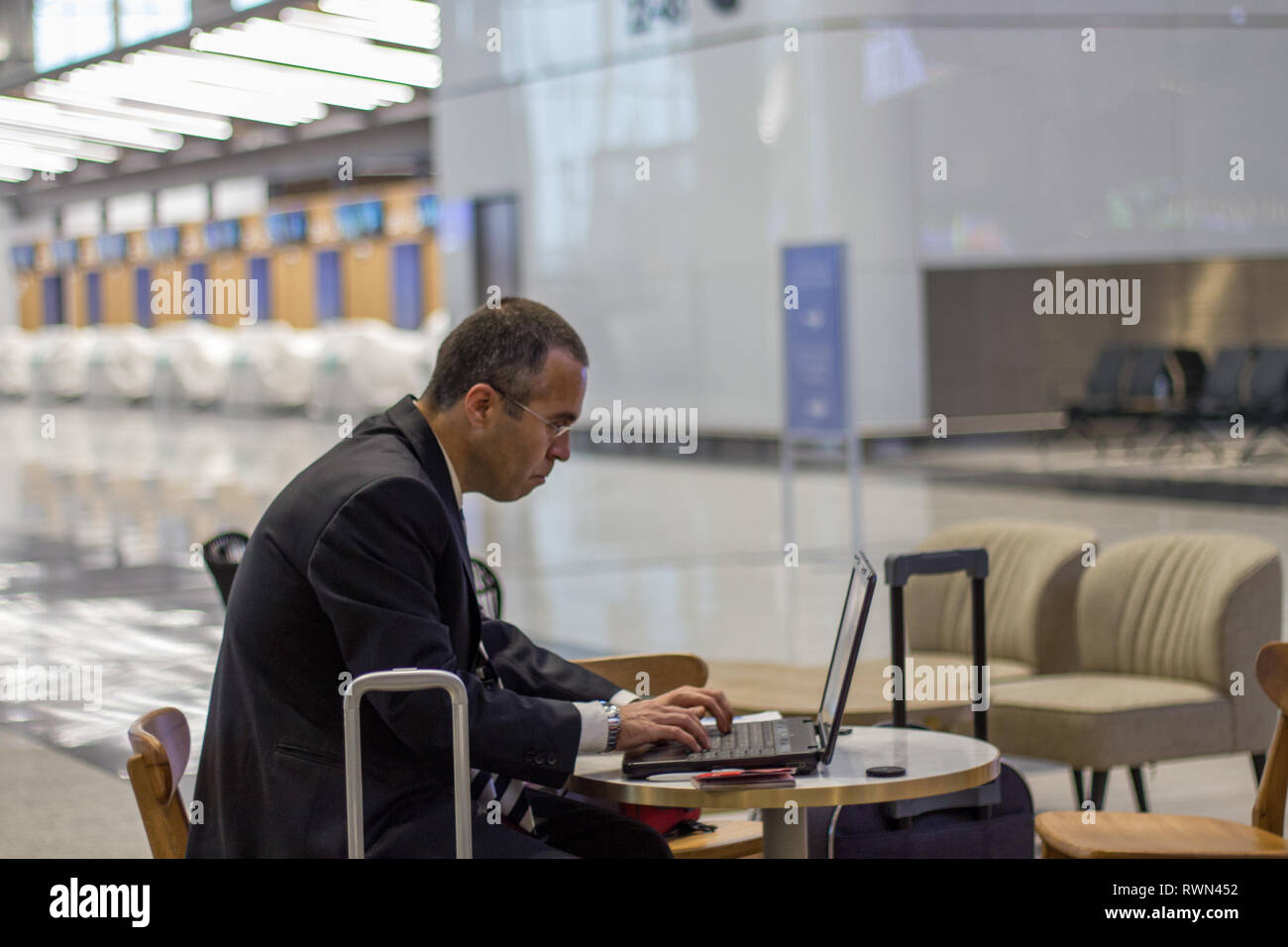 Passenger business man working with laptop at the airport Stock Photo ...