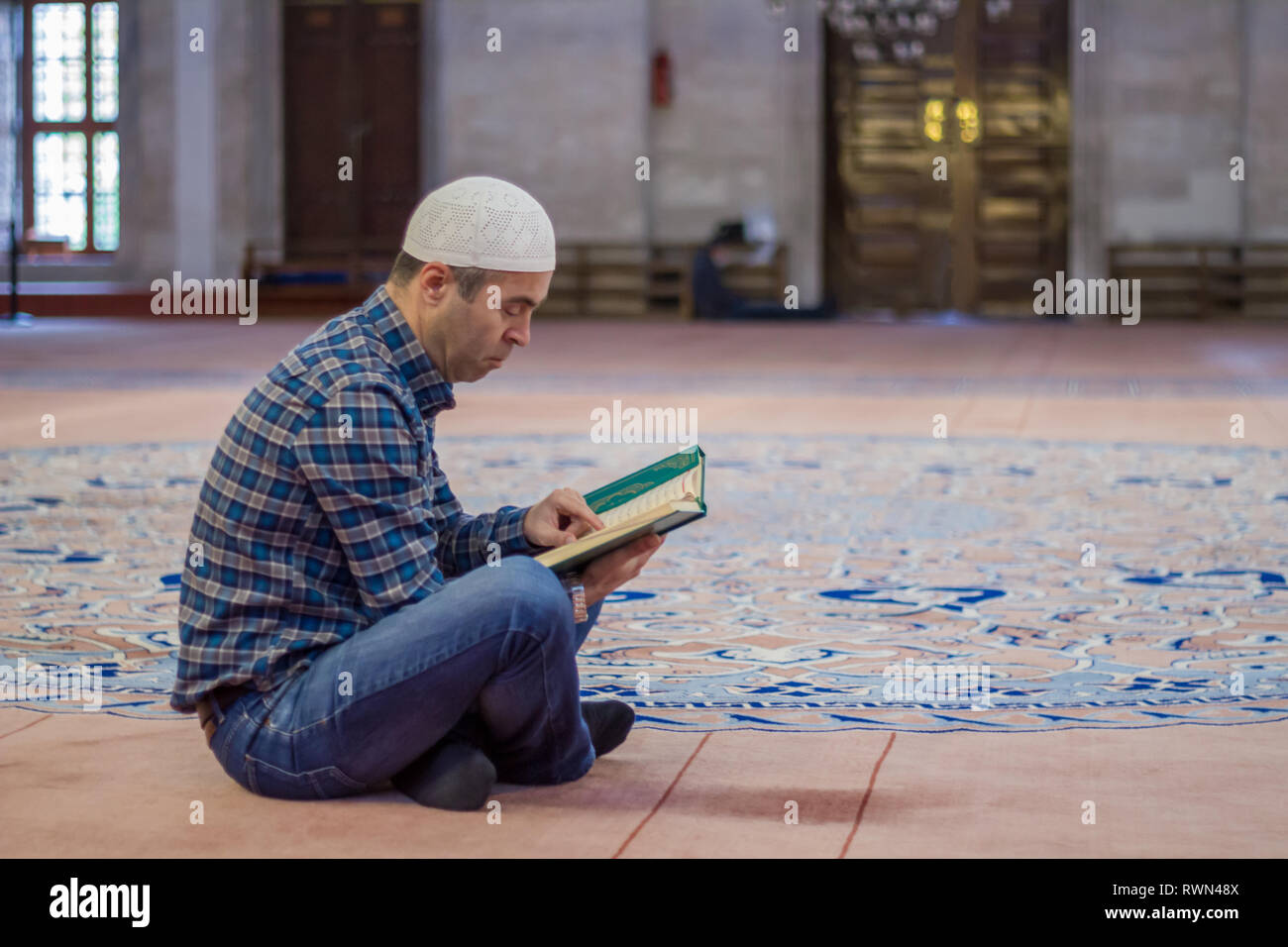 Man Reading Quran