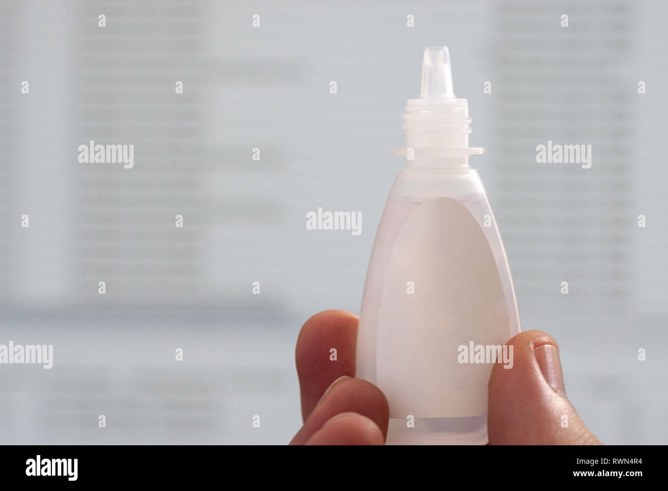 eye drops on the background of the monitor. fatigue and eye pain from ...