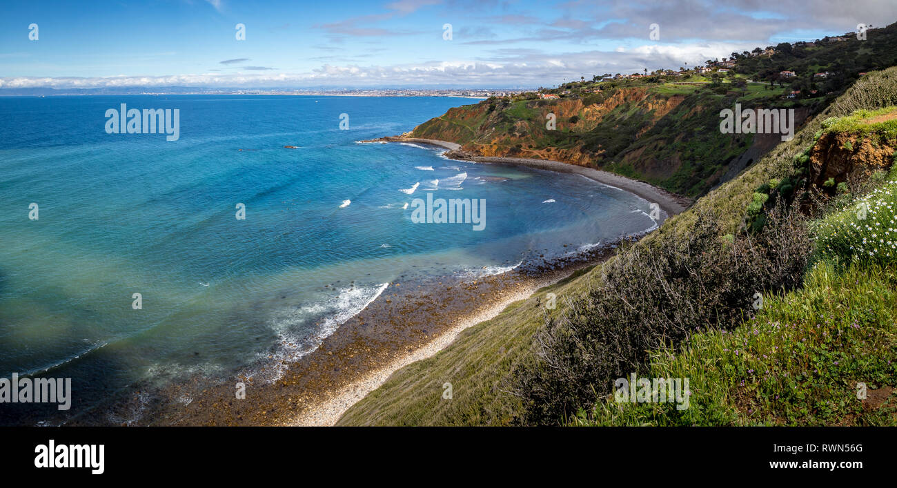 Vivid Southern California coastal view of tall, grass covered cliffs of ...