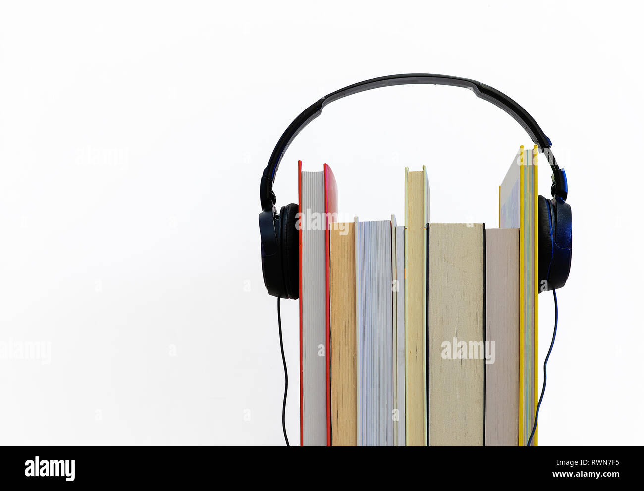 Books and Headphones. Audio book concept. Headphones and books on white ...