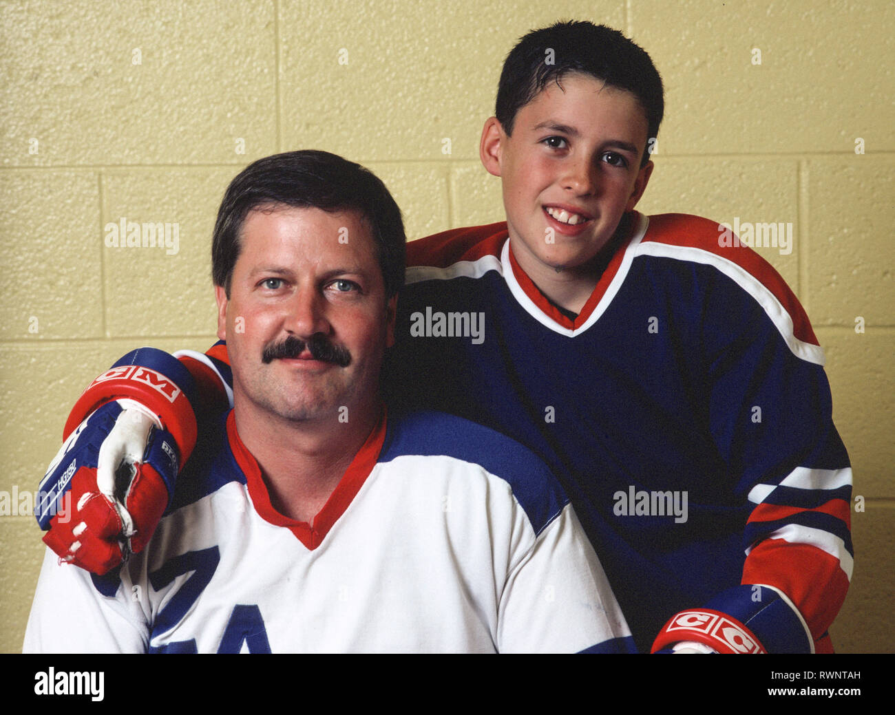 Father and son Hockey Players Pose in Full Uniform and Pads, USA Stock ...