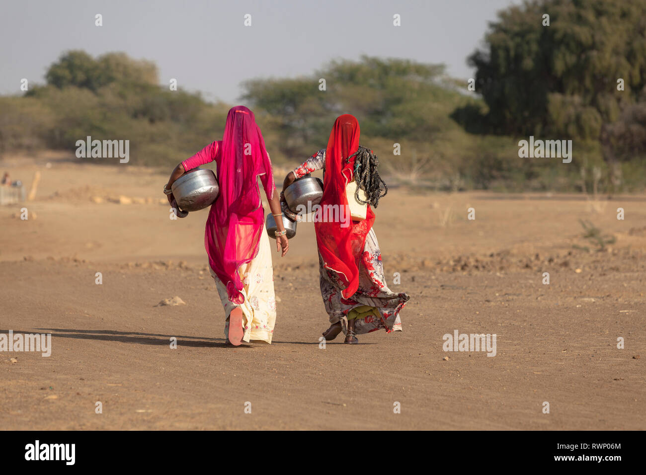 Indian woman in sari fetching hi-res stock photography and images - Alamy