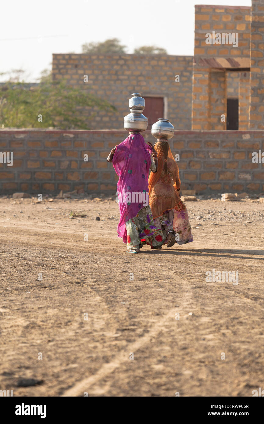 Woman fetching water in the the Thar Desert, Khuri , Rajasthan, India ...