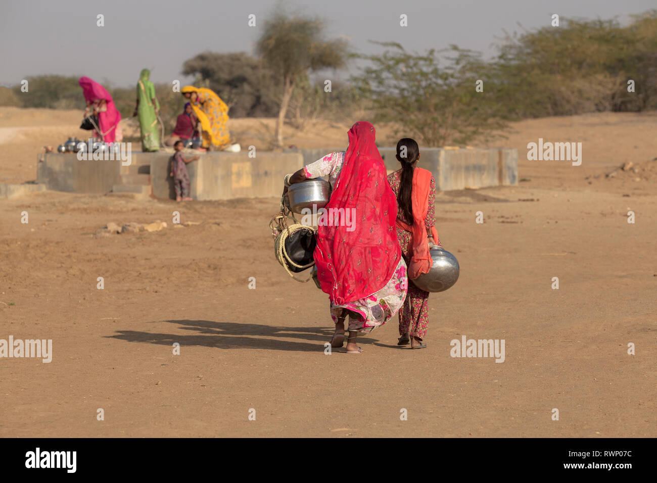 Woman fetching water in the the Thar Desert, Khuri , Rajasthan, India ...