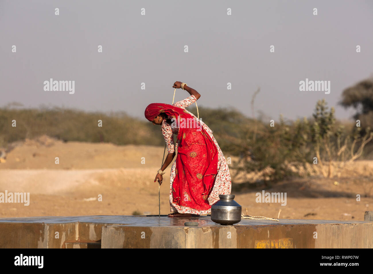 Women Fetching Water Stock Photos & Women Fetching Water Stock Images ...