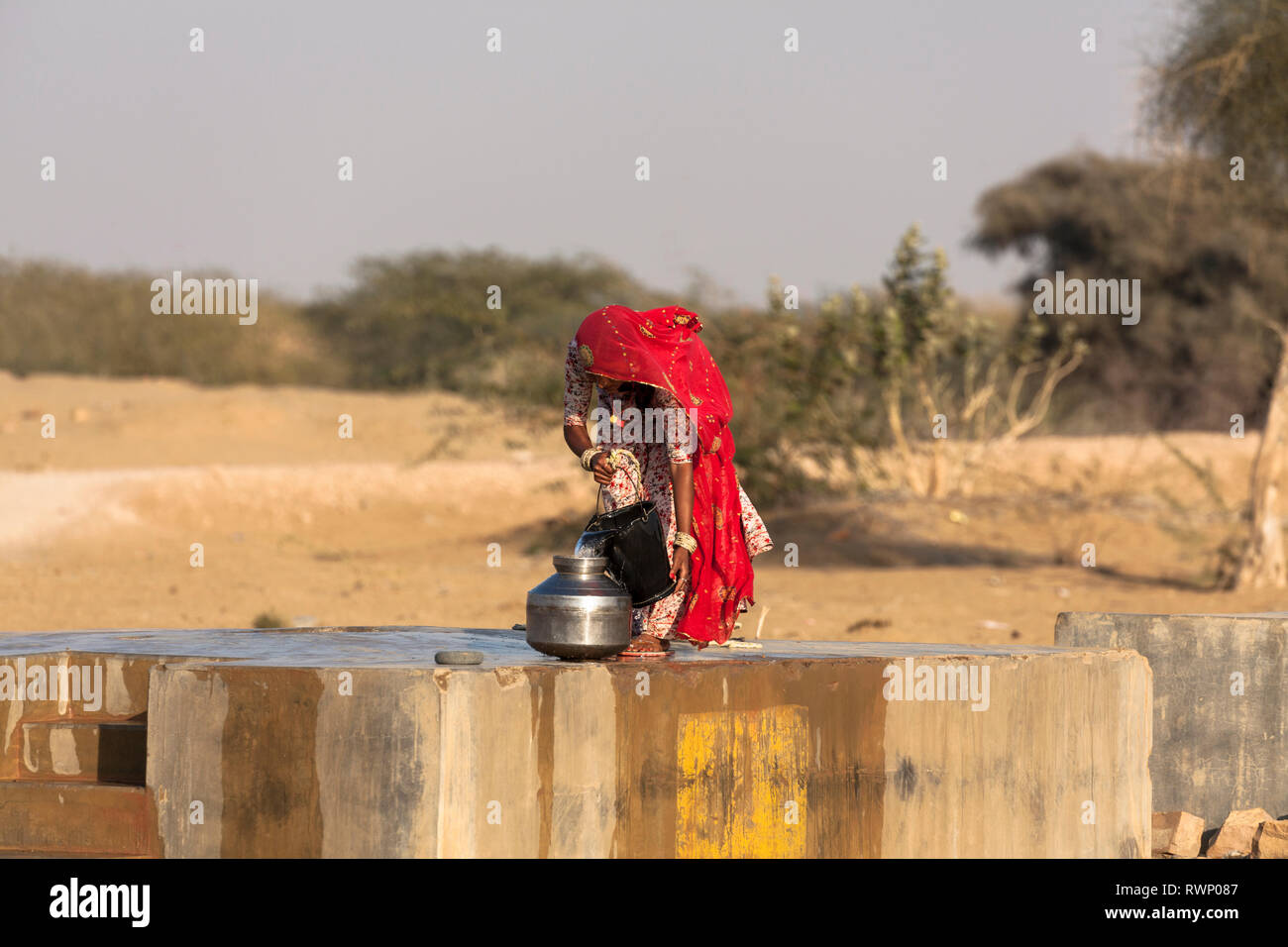 Woman fetching water in the the Thar Desert, Khuri , Rajasthan, India ...