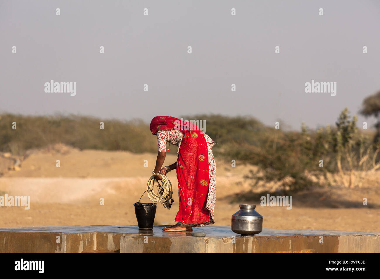 Woman fetching water in the the Thar Desert, Khuri , Rajasthan, India ...