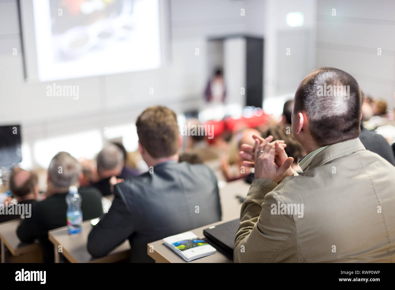 Business speaker giving a talk at business conference event Stock Photo ...