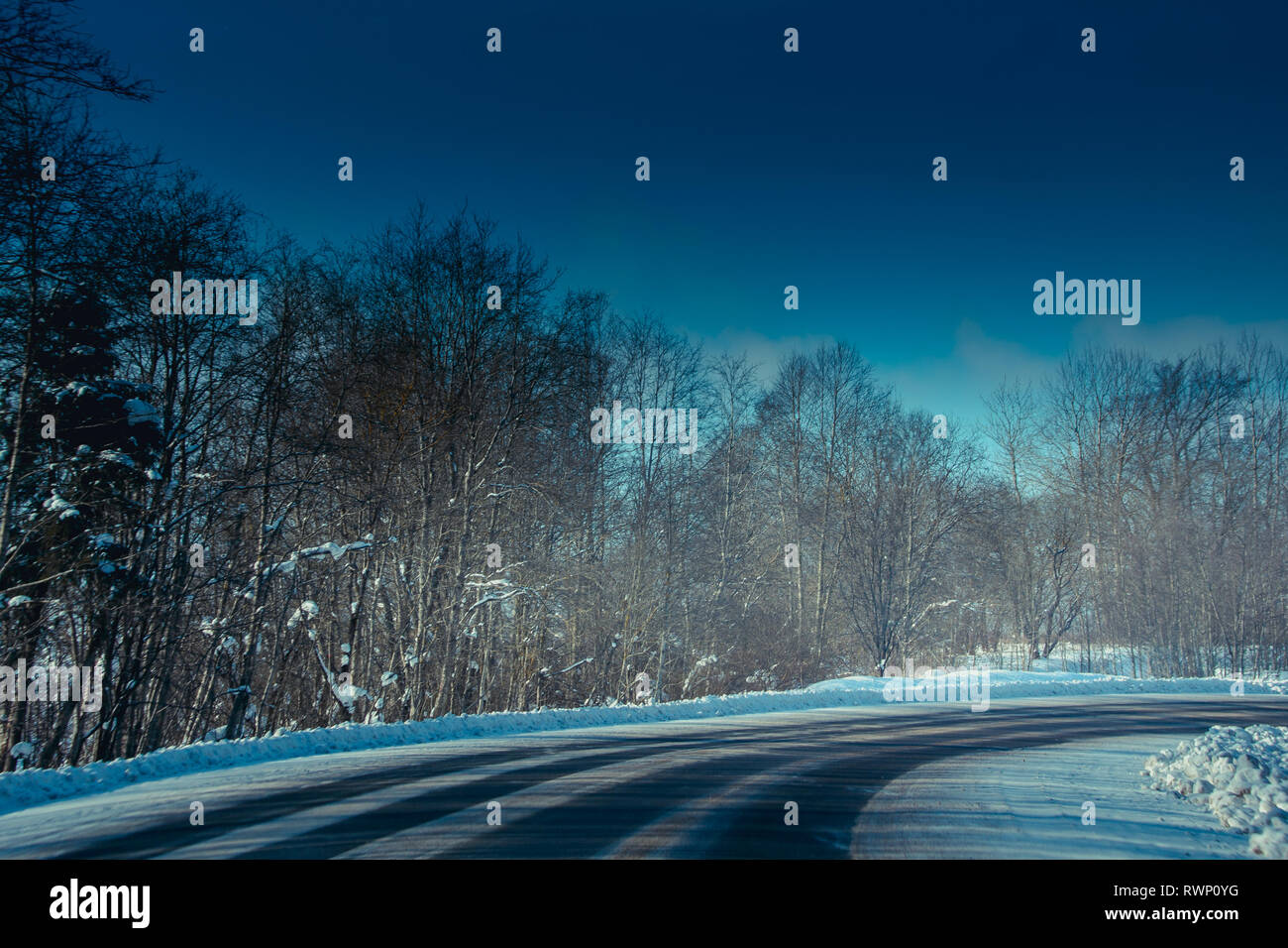 Snowy winter road. The road is covered up. Russian dear. Winter fairy ...