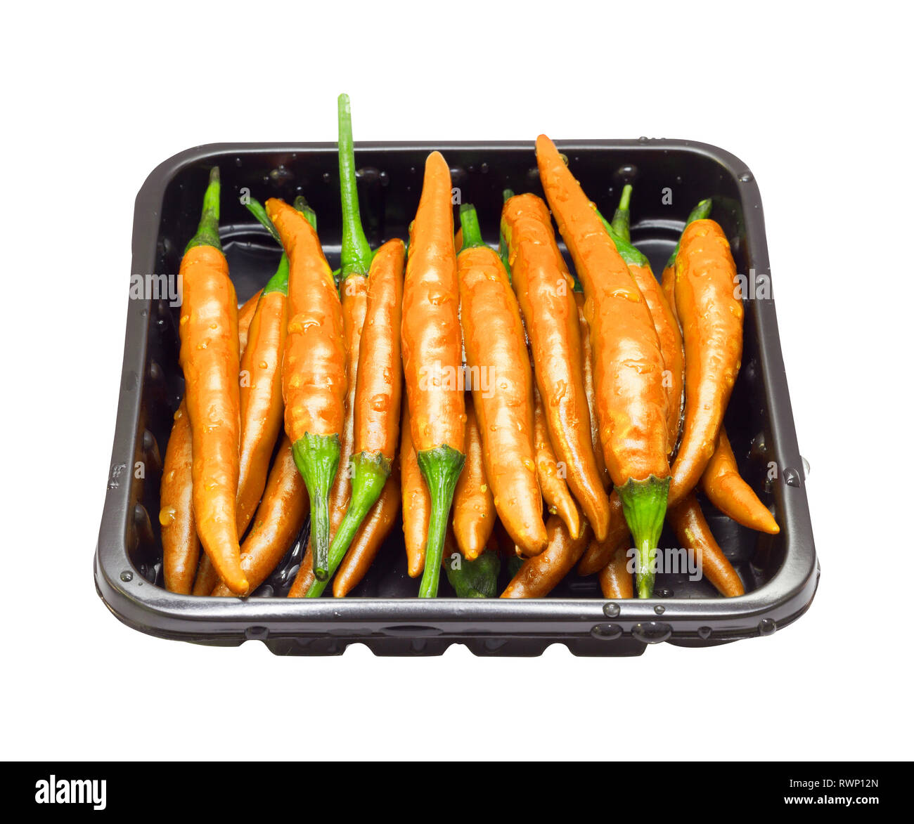 Gold chilli peppers, hot pepper in Packing on isolated white background ...