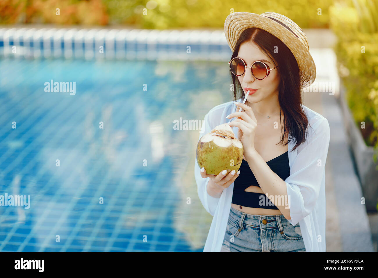 Attractive woman coconut drink hi-res stock photography and images - Alamy