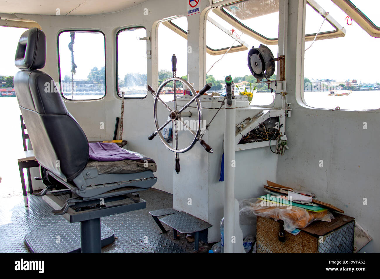 The wheelhouse on a ferry boat in Thailand. The empty control cabin on ...