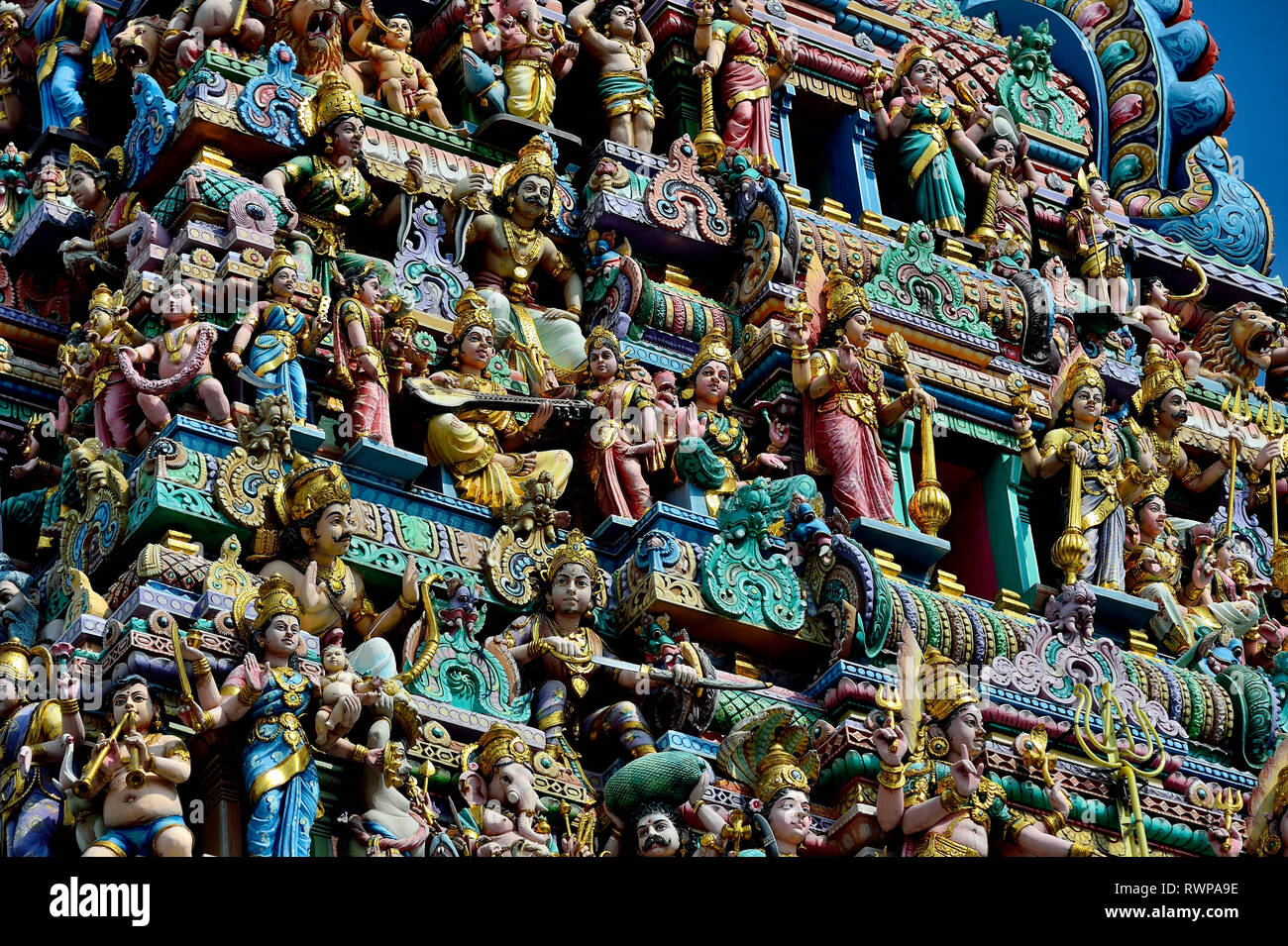 Colourful statues of Hindu religious deities adorning the entrance of a ...