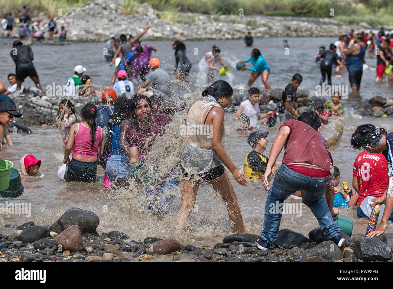 Valle de Chota, Ecuador- March 4, 2019: people throwing river water to ...