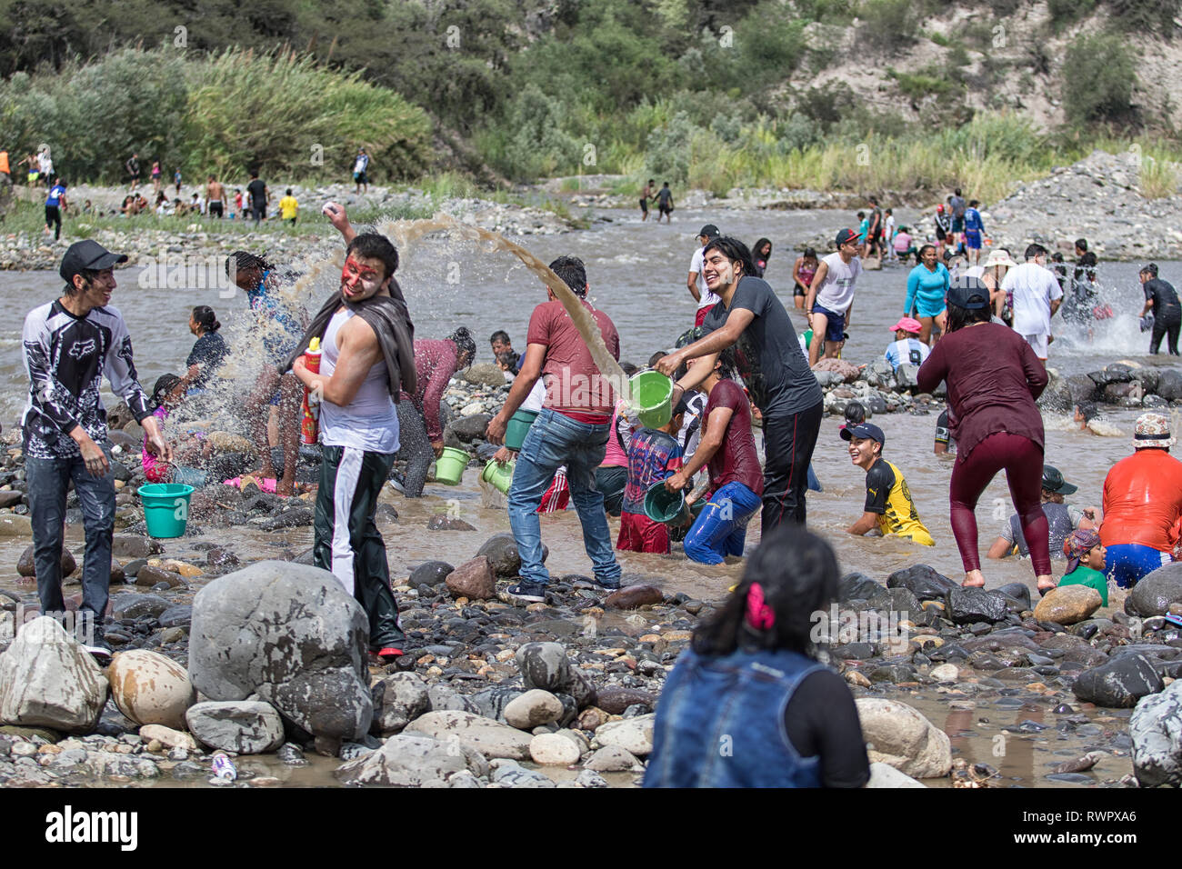 Valle de Chota, Ecuador- March 4, 2019: people throwing river water to ...