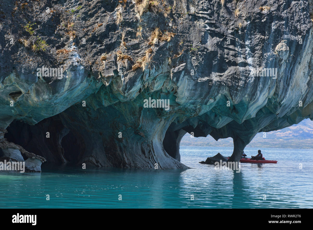 Kayaker exploring the surreal Marble Caves (Capilla de Mármol), Rio ...