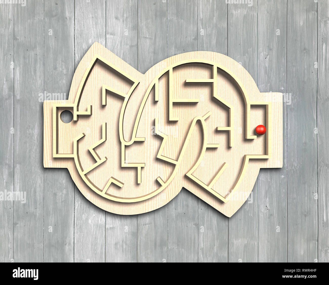 Maze ball game in money shape box, on wooden background Stock Photo - Alamy