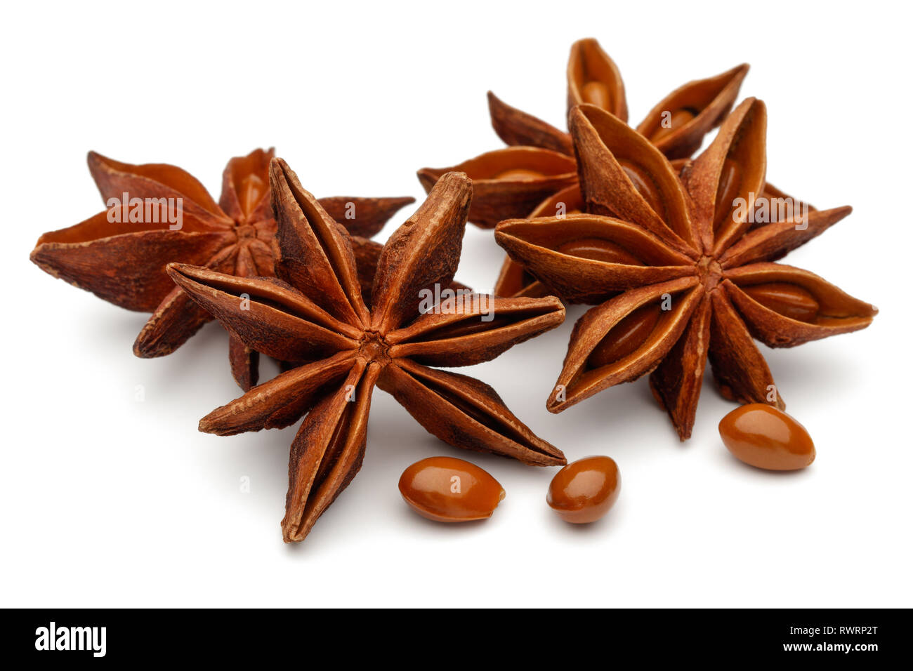 Star anise and seeds isolated on white background Stock Photo - Alamy