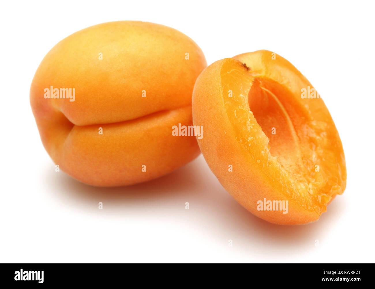 Fresh apricot fruits isolated on white background Stock Photo - Alamy