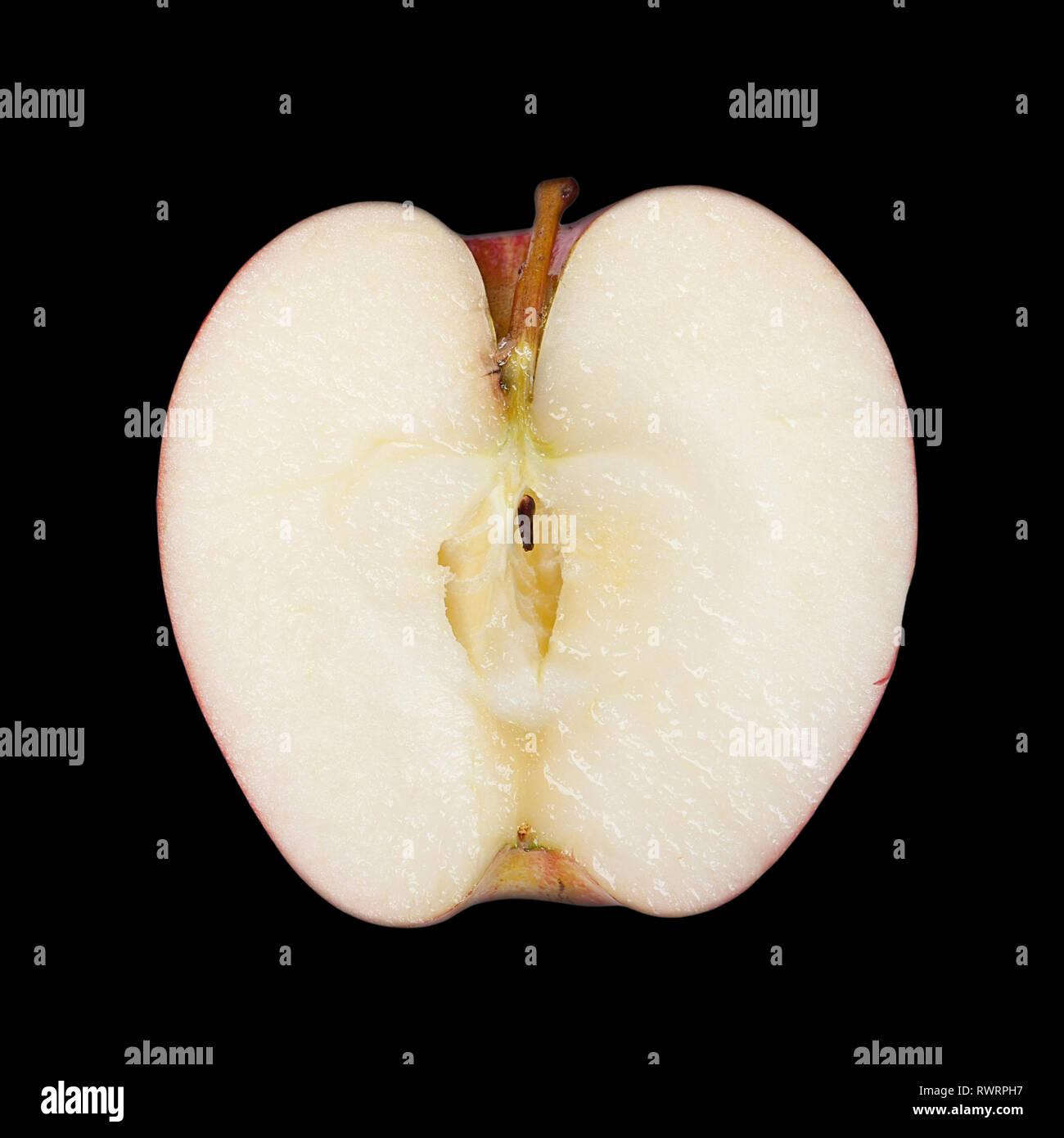 Segment of red apple isolated on black background Stock Photo - Alamy