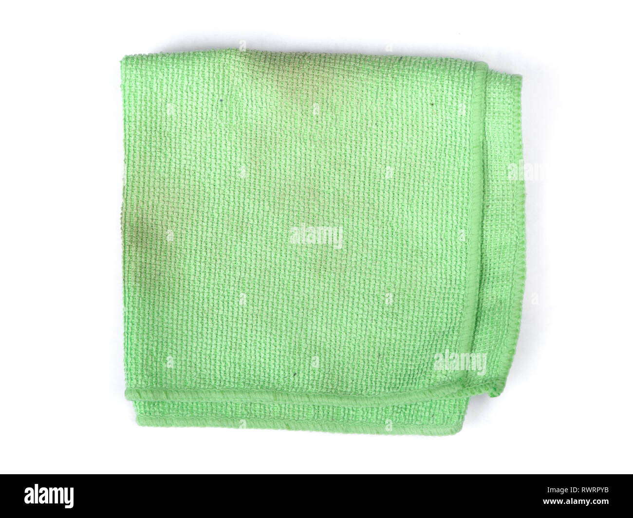 Folded green microfiber cloth isolated on white background Stock Photo ...