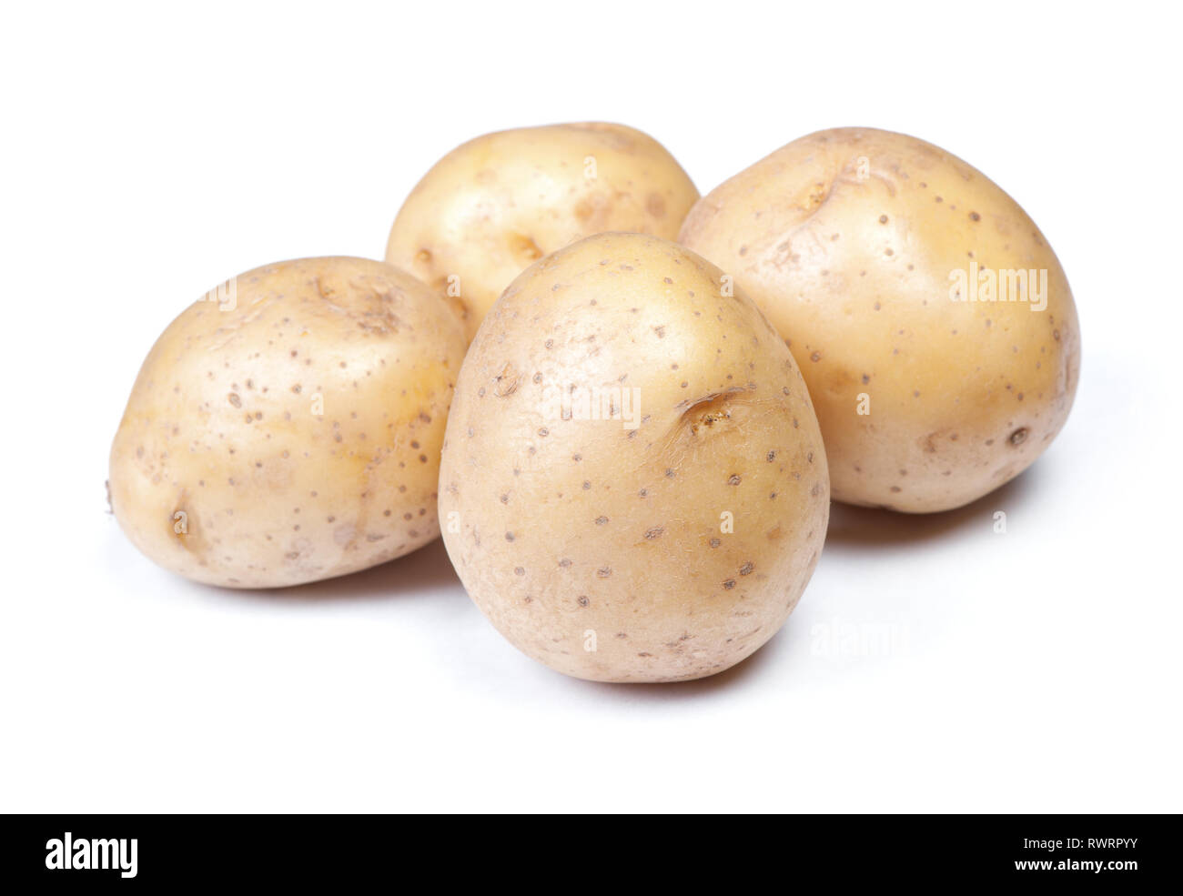 Heap of flawed natural potatoes isolated on white background Stock ...